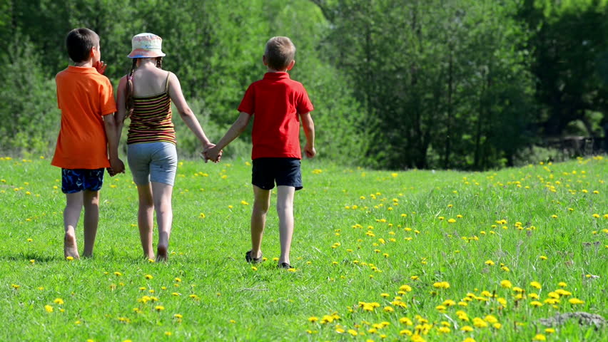 happy young children running around field Stock Footage Video (100% ...
