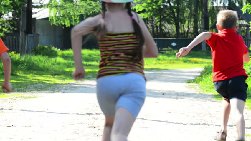 happy young children running around field Stock Footage Video (100% ...