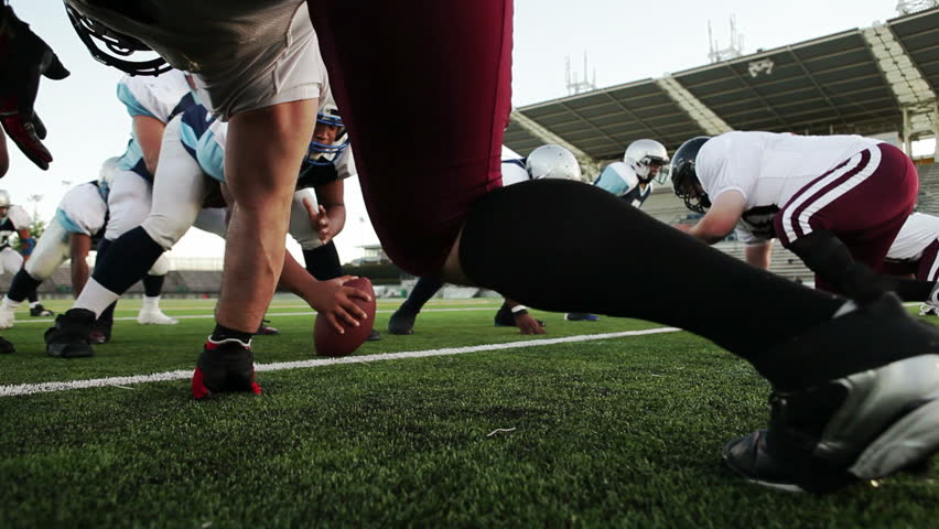 close football players linemen lining snapping Stock Footage Video (100 ...