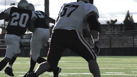 Quarterback Hands Off Ball Running Back Stock Footage Video (100% ...