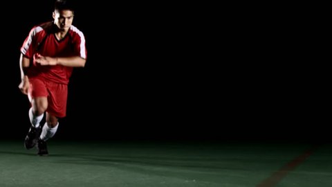 soccer player runs camera kicks ball Stock Footage Video (100% Royalty ...