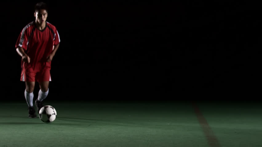 soccer player runs camera kicks ball Stock Footage Video (100% Royalty ...