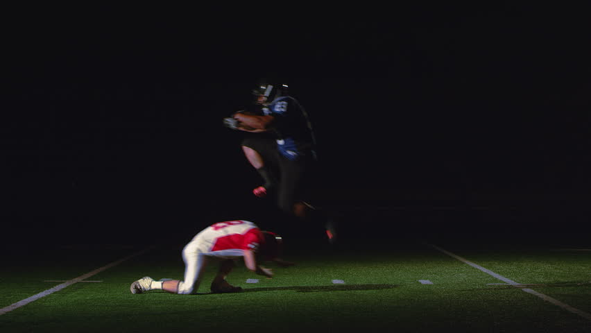 football player jumps over another who Stock Footage Video (100% ...