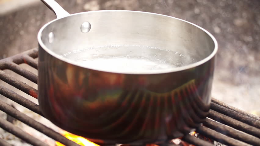 pot boiling water over fire pit Stock Footage Video (100% Royalty-free ...