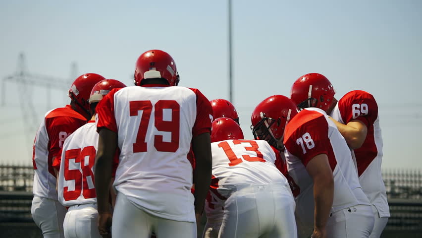 camera tilt football team standing huddle Stock Footage Video (100% ...