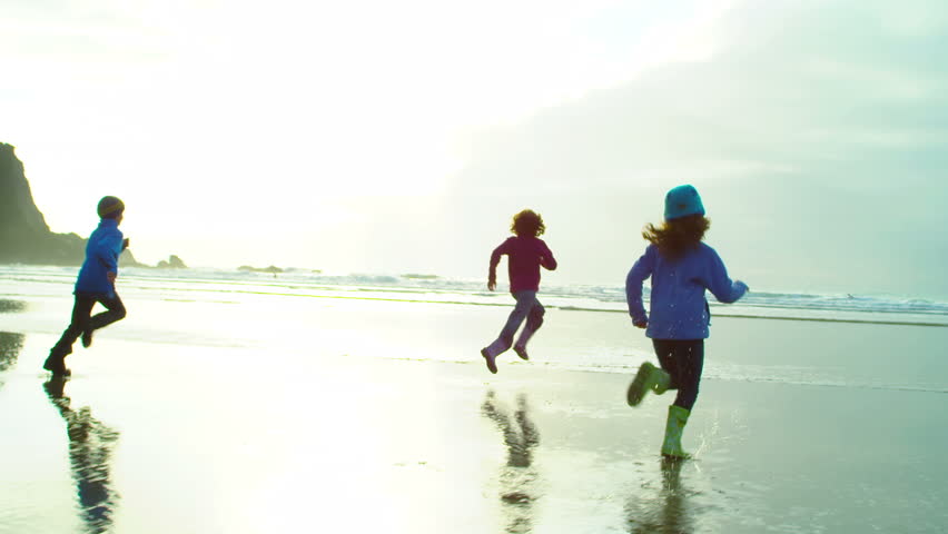 three kids run down beach bright Stock Footage Video (100% Royalty-free ...