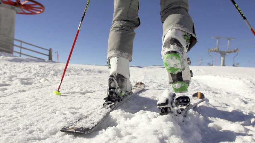 slow motion rear shot skier attaching Stock Footage Video (100% Royalty ...