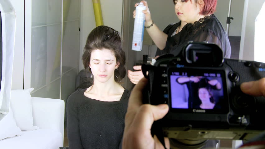 model getting hair done while photographer Stock Footage Video (100% ...