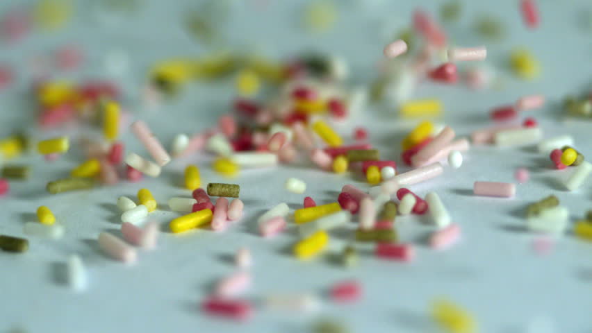 sprinkles falling onto blue surface slow Stock Footage Video (100% ...