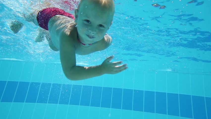 young girl swimming underwater touching bottom Stock Footage Video (100 ...