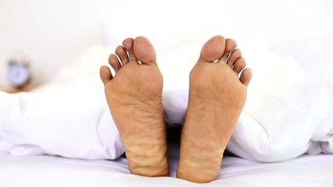 Man Wiggling His Toes Under Covers Stock Footage Video (100% Royalty ...