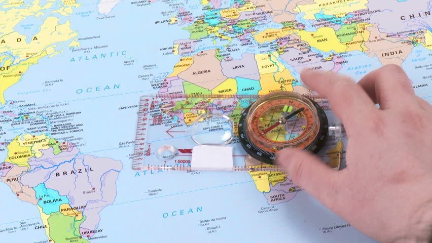 hand moving compass over world map Stock Footage Video (100% Royalty ...