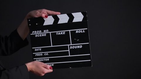 Female Hands Using Clapperboard Against Black Stock Footage Video (100% ...