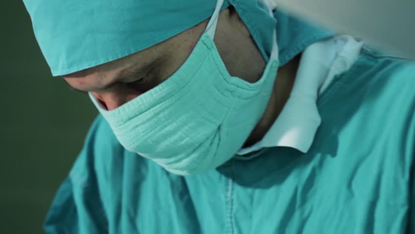 surgeon close face performing operation hospital Stock Footage Video ...