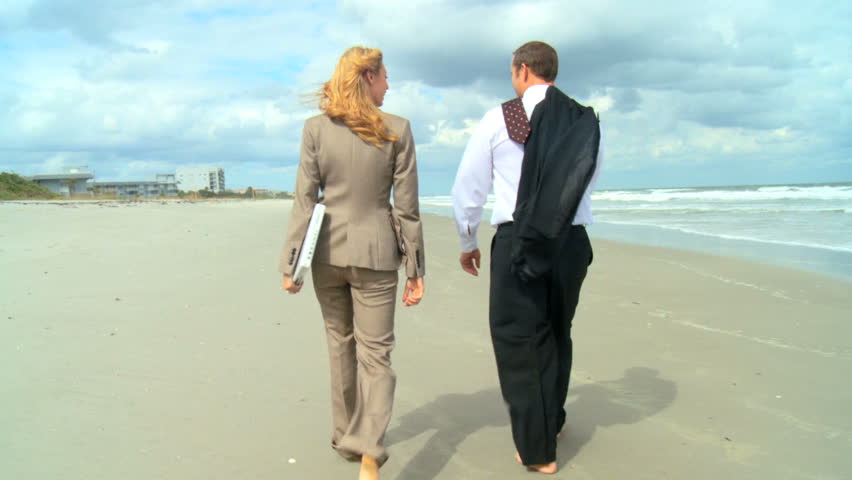 two young business people escaping office Stock Footage Video (100% ...