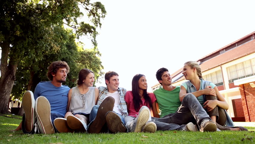 Students Sitting Outside Talking Together Stock Footage Video (100% ...