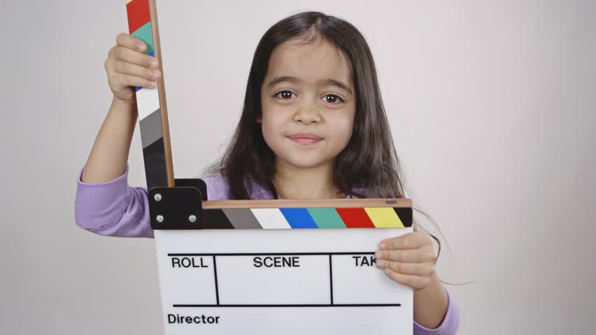 Girl Uses Directors Slate and Stock Footage Video (100% Royalty-free ...
