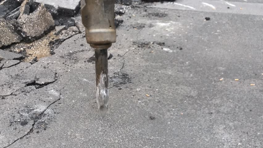 breaking asphalt pavement jack hammer Stock Footage Video (100% Royalty ...