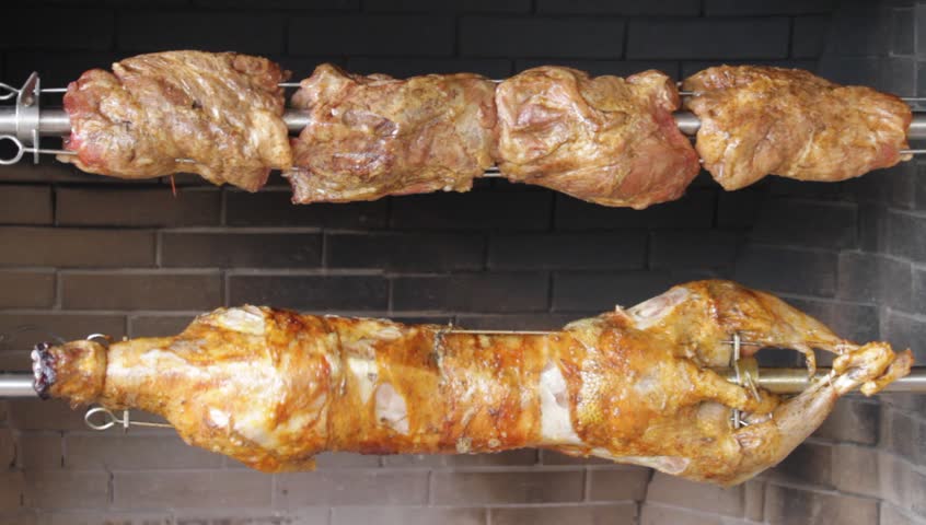Meat Roasting On a Spinning Stock Footage Video (100% Royalty-free ...