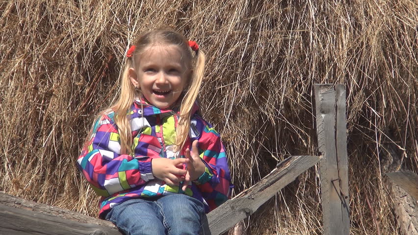 happy child waving goodbye by haystack Stock Footage Video (100% ...