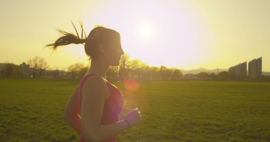 Slow Motion: Young Woman Jogs Stock Footage Video (100% Royalty-free ...