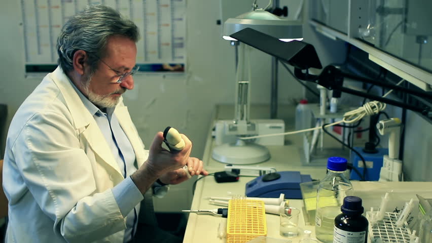 Biochemist Working in a Laboratory Stock Footage Video (100% Royalty ...