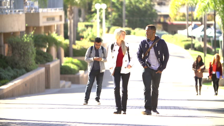 students walking outdoors on university campus Stock Footage Video (100 ...