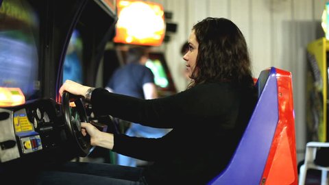 Girl Playing Racing Arcade Game Stock Footage Video (100% Royalty-free ...