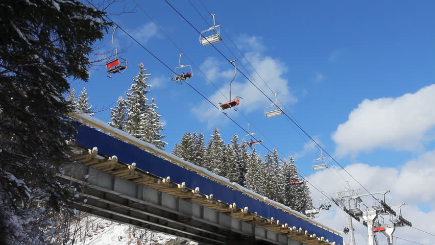 ski lifts moving over pedestrian bridge Stock Footage Video (100% ...
