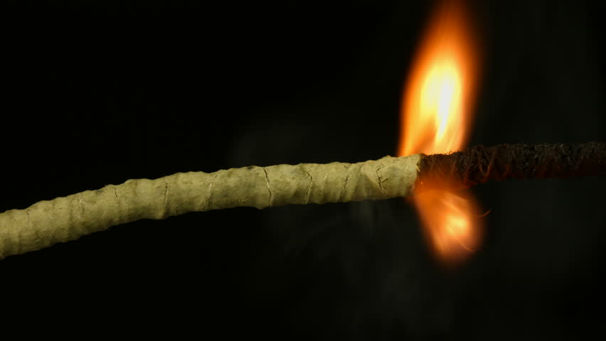 Red Stick Of Tnt Dynamite With Long Fuse With Clouds And