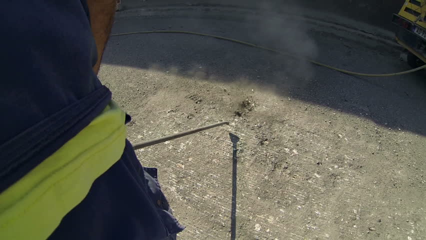 worker blows dust compressed air road Stock Footage Video (100% Royalty ...