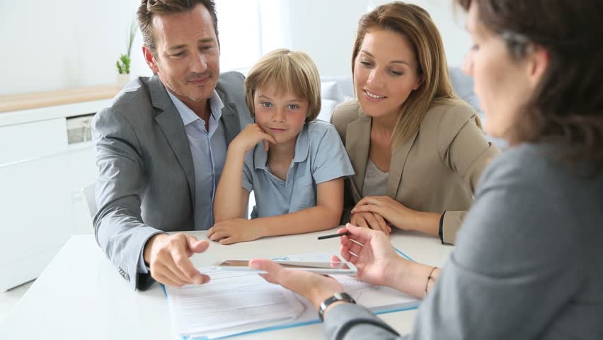 family signing home purchase contract on Stock Footage Video (100% ...