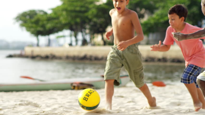 kids playing soccer on beach Stock Footage Video (100% Royalty-free ...