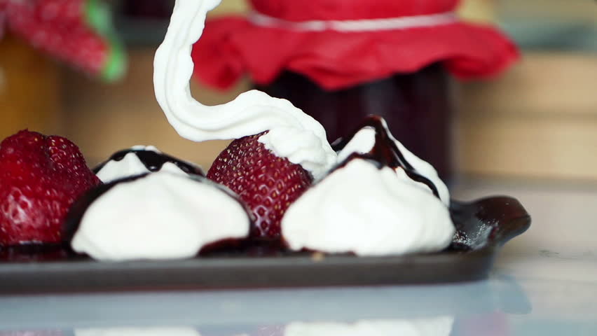 adding whipped cream on tasty dessert Stock Footage Video (100% Royalty ...