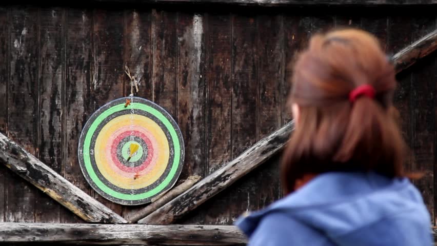 girl playing darts hitting target on Stock Footage Video (100% Royalty ...