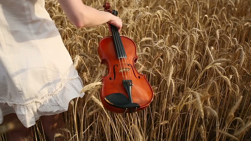 Violinist Girl Walking Through a Stock Footage Video (100% Royalty-free ...