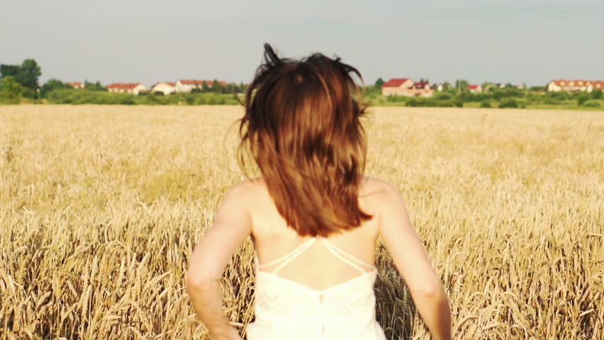woman running through wheat field super Stock Footage Video (100% ...