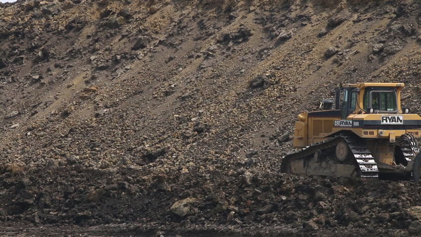 caterpillar construction vehicles excavate building site Stock Footage ...