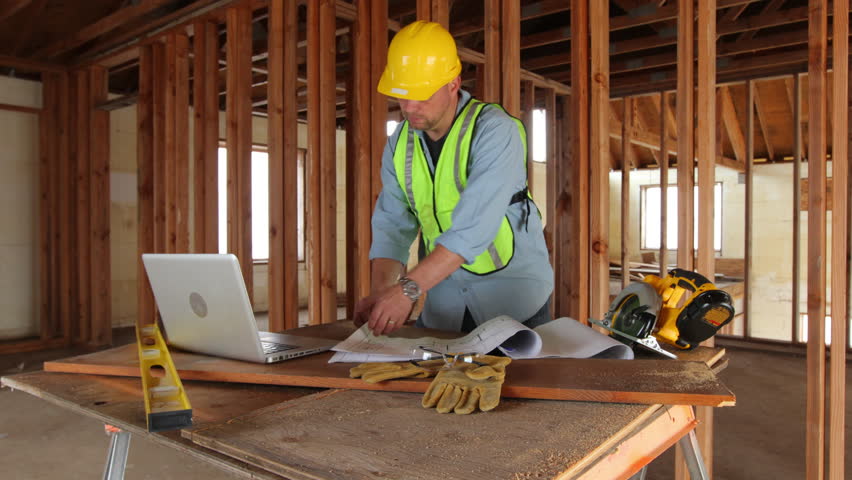 construction worker uses laptop computer Stock Footage Video (100% ...