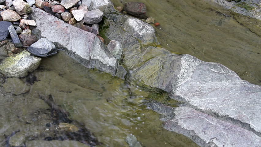 water trickling down rock into small Stock Footage Video (100% Royalty ...