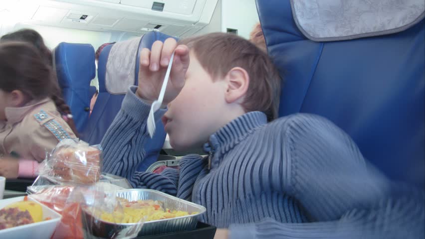 little serious boy eats plane salon Stock Footage Video (100% Royalty ...