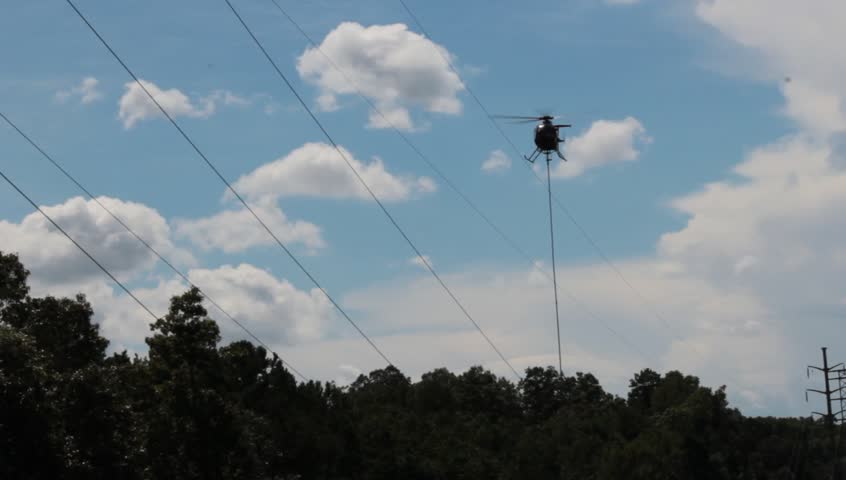 helicopter passes over power lines preparing Stock Footage Video (100% ...