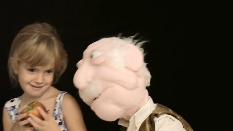 Little Girl Eating Apple Puppet Old Stock Footage Video (100% Royalty ...