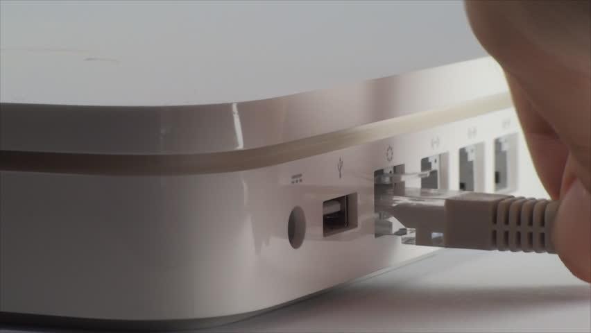 hand plugging ethernet cable into router Stock Footage Video (100% ...