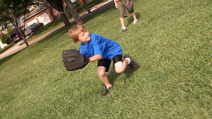 two young boys catching returning baseball Stock Footage Video (100% ...