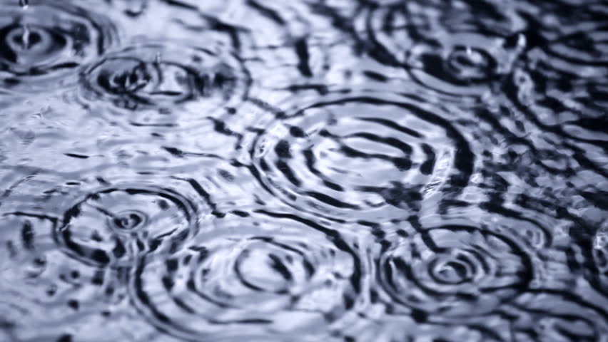 Rain Falling Into a Puddle Stock Footage Video (100% Royalty-free ...
