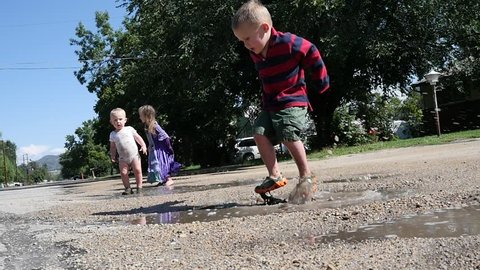 Slow Motion Kids Jumping Mud Puddle Stock Footage Video (100% Royalty ...