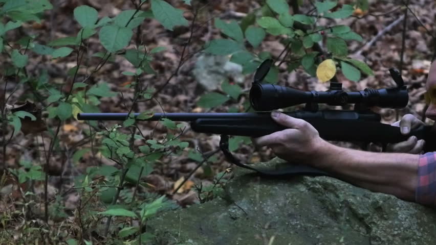 man firing hunting gun slow motion Stock Footage Video (100% Royalty ...