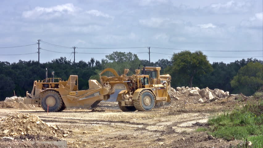 video two large machines scrape dump Stock Footage Video (100% Royalty ...