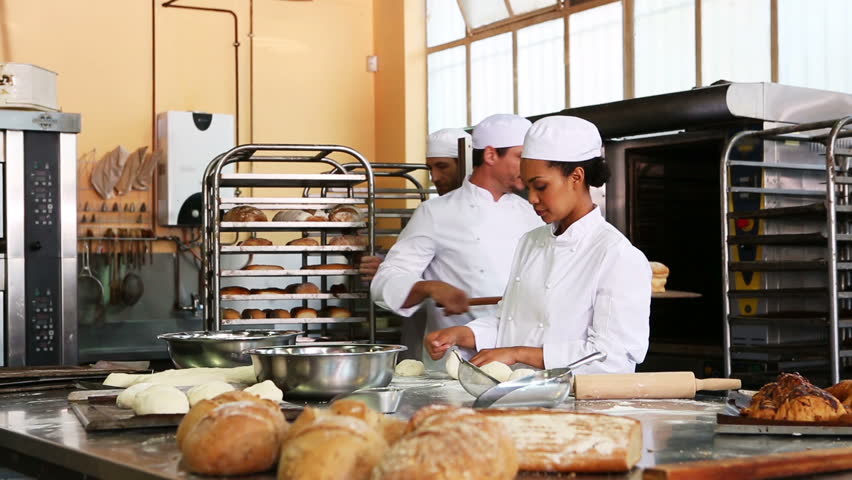 team bakers working together commercial kitchen Stock Footage Video ...